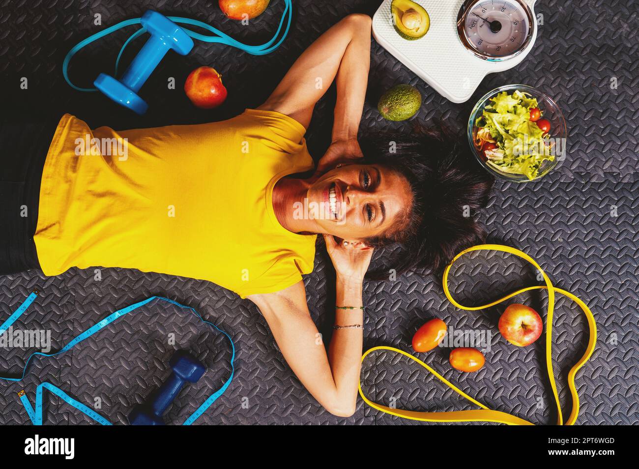 Happy woman does exercises at the gym Stock Photo - Alamy