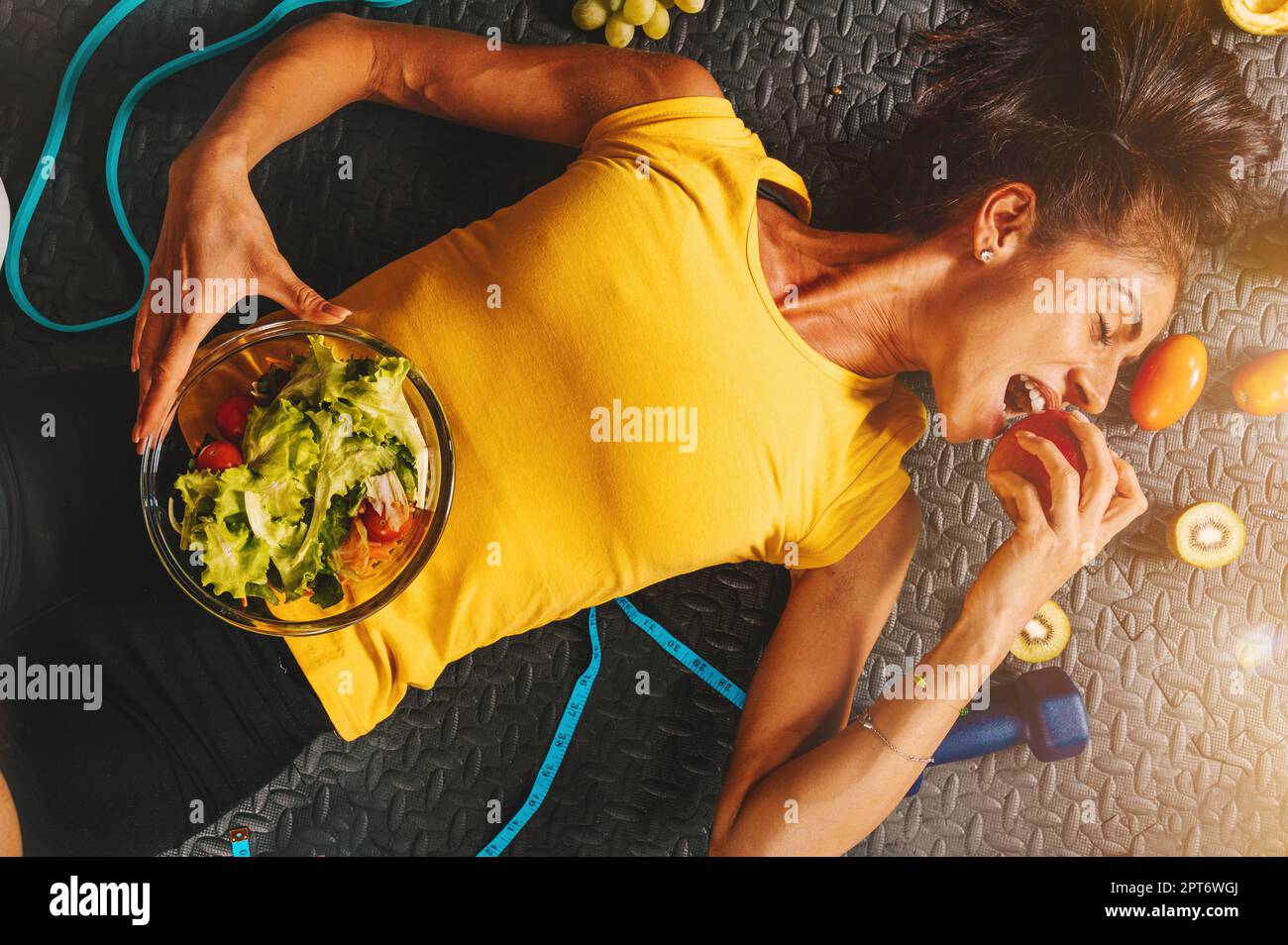 Woman eat healthy and trains in the gym Stock Photo - Alamy