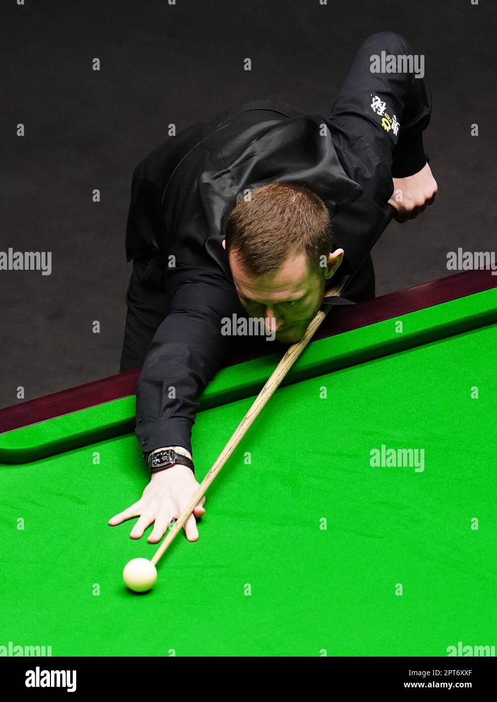 Mark Allen in action against Mark Selby (not pictured) on day thirteen ...
