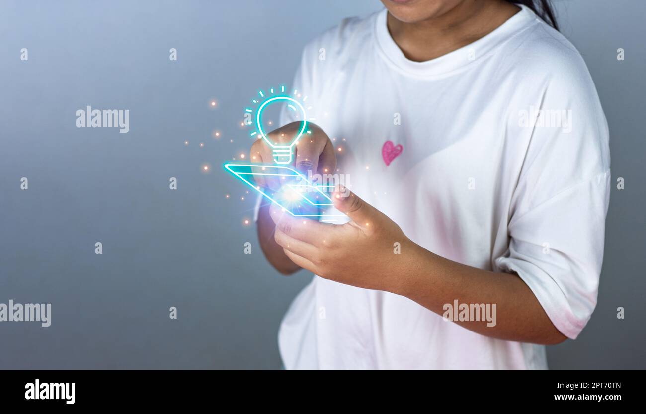 Educational concept picture. A girl stands holding an education icon ...
