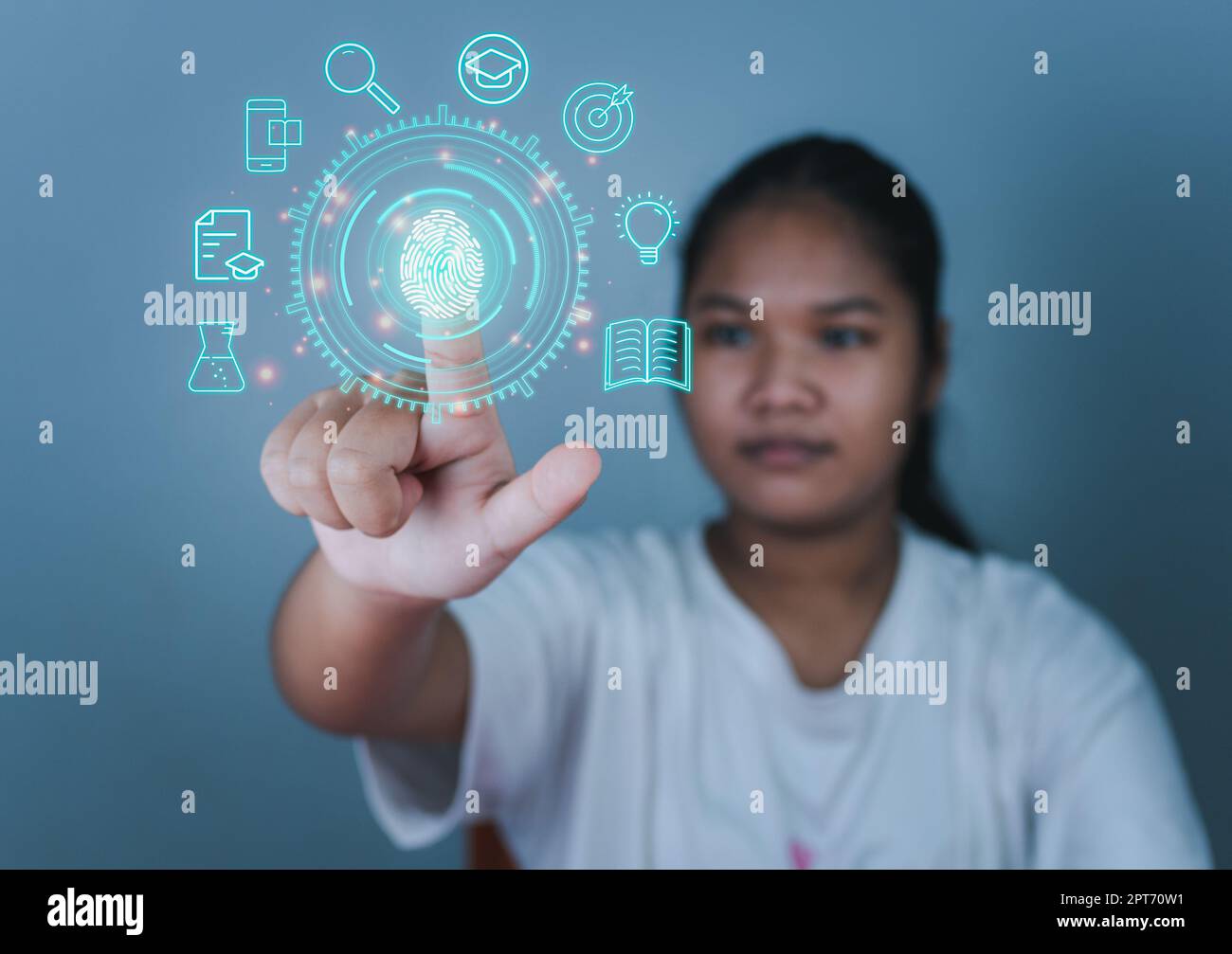 Educational concept picture. A girl stands holding an education icon ...