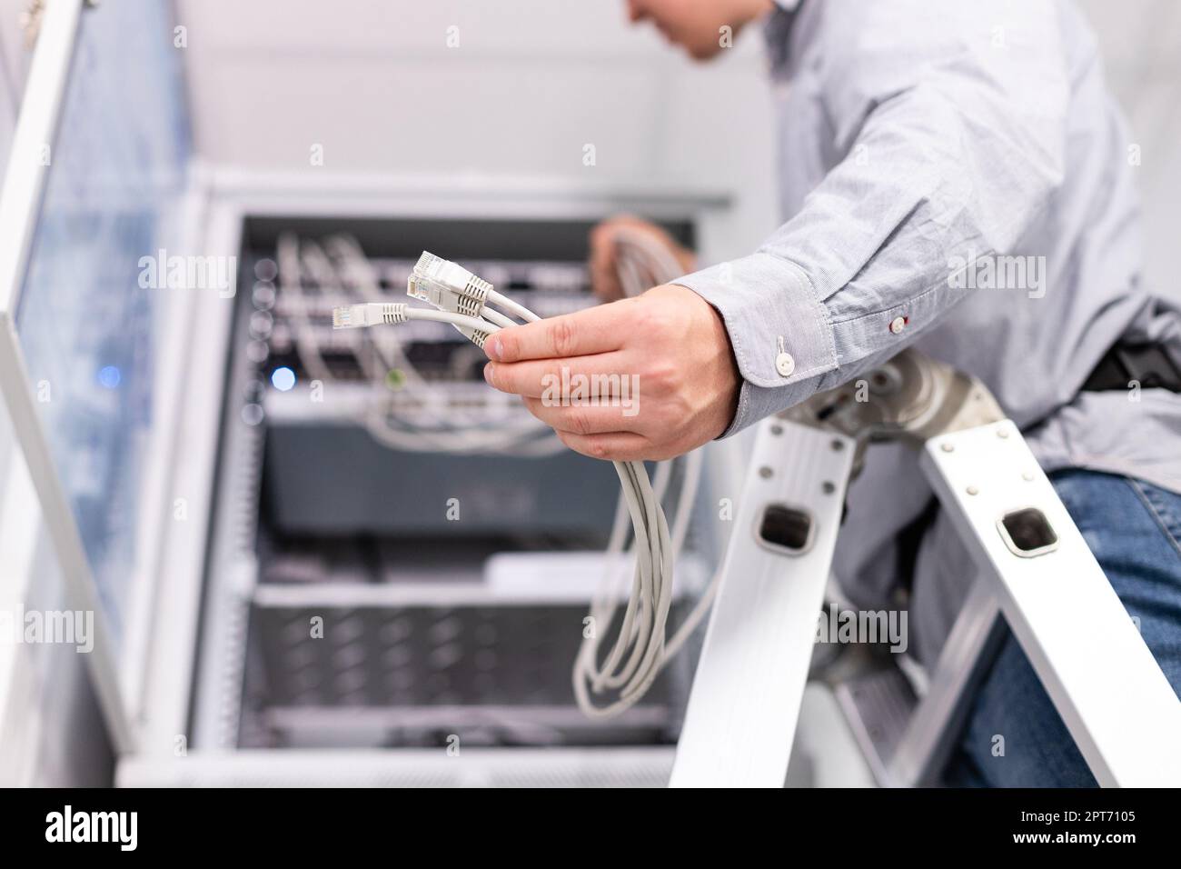 Network engineer plugs cable device hi-res stock photography and images ...
