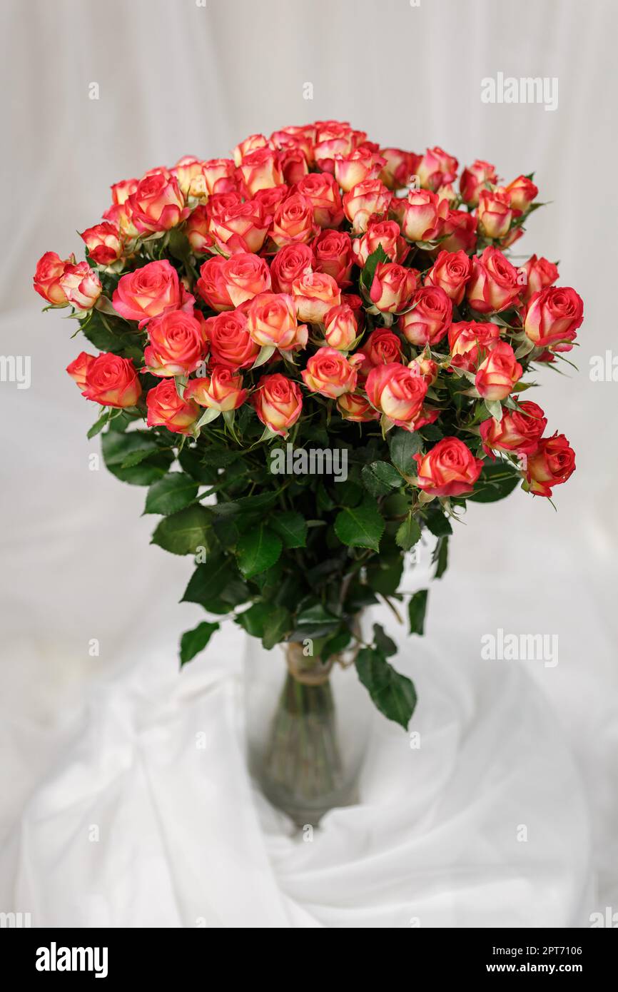 Bouquet consisting of many pink roses with tall stem and which stands ...