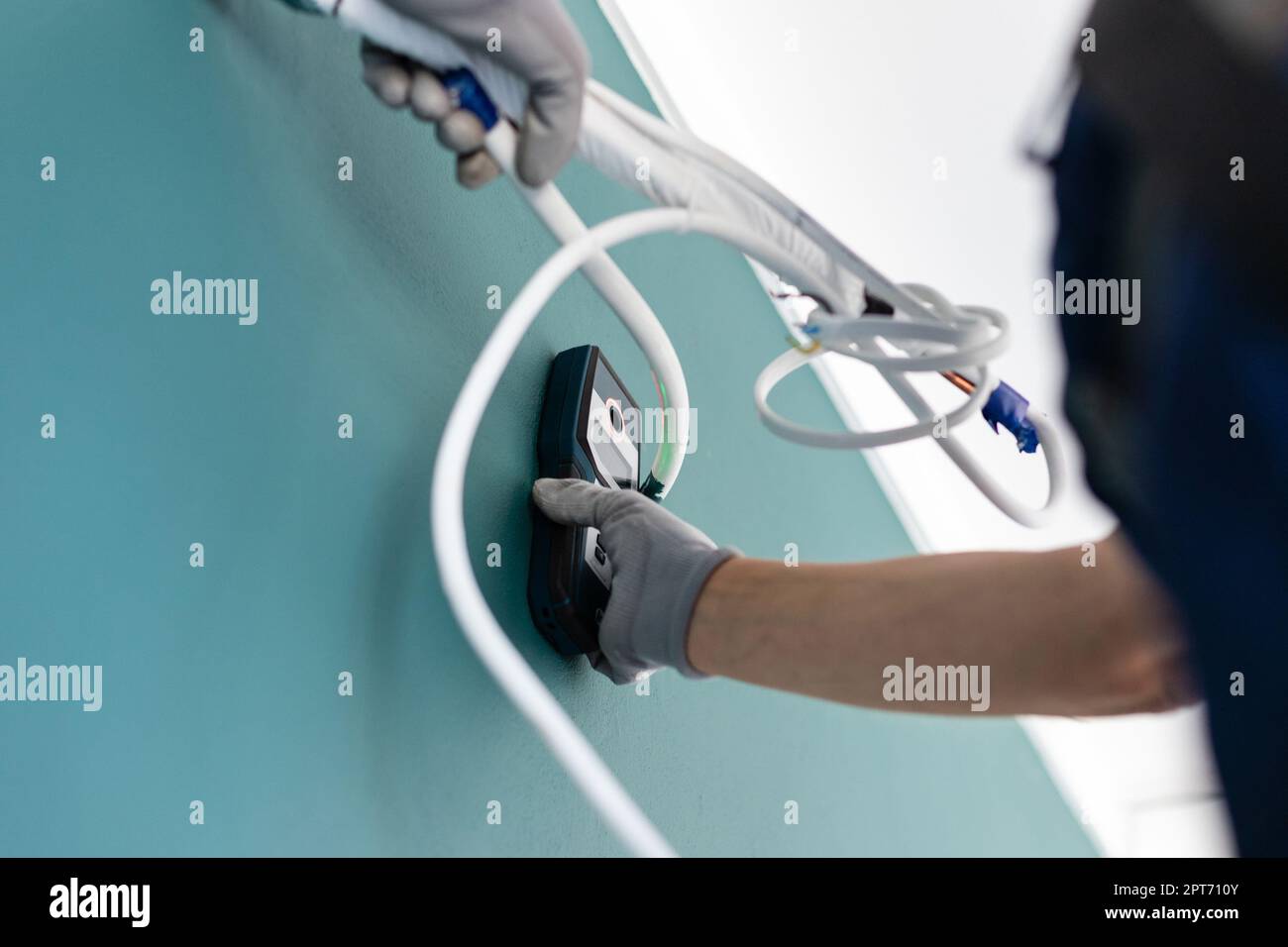 Construction worker uses electronic laser hi-res stock photography and ...