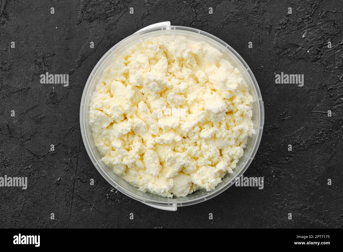 Top view of homemade cottage cheese in plastic bowl Stock Photo - Alamy