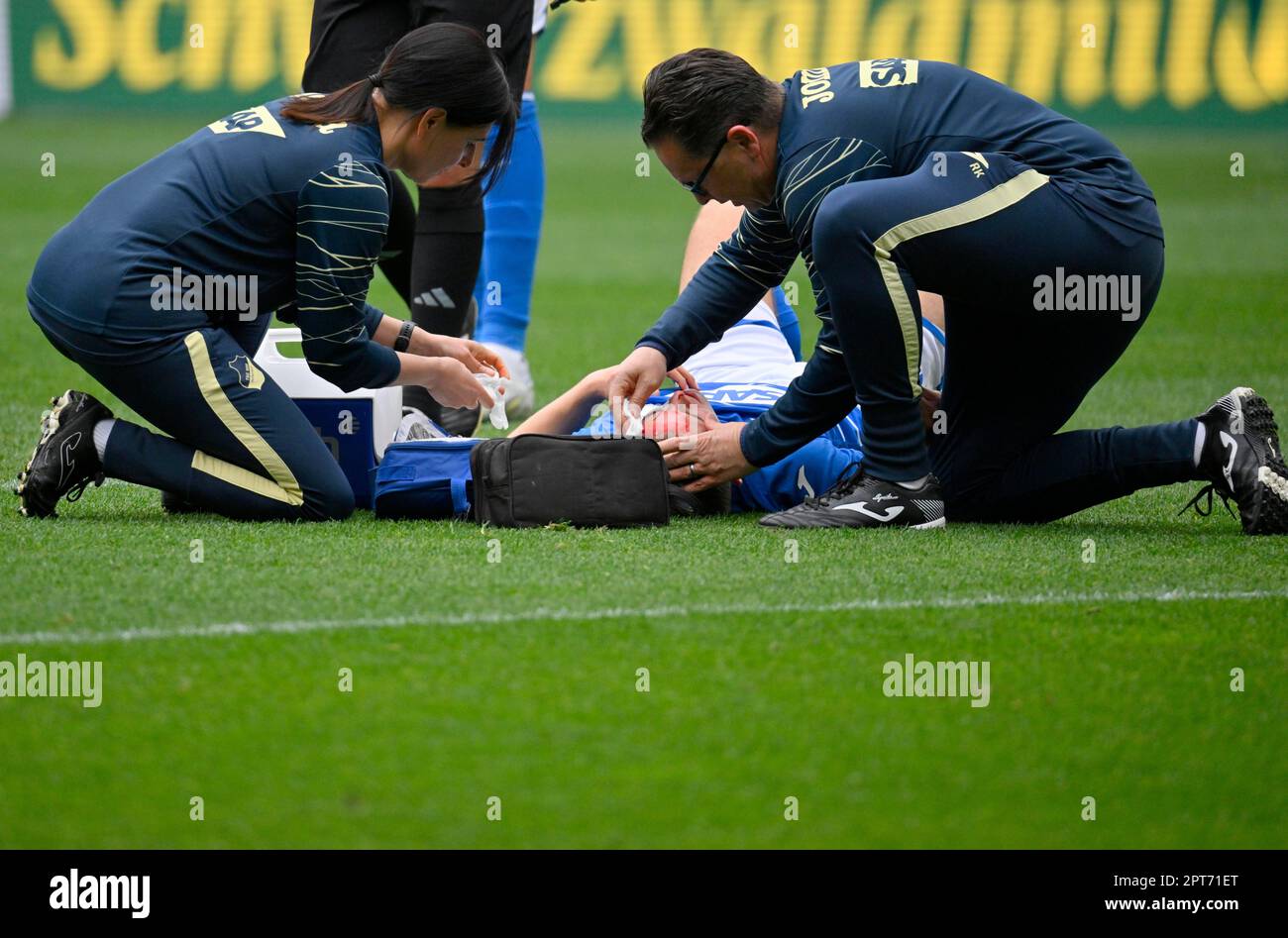 Attendants treat bleeding head wound after header duel of Finn Ole ...