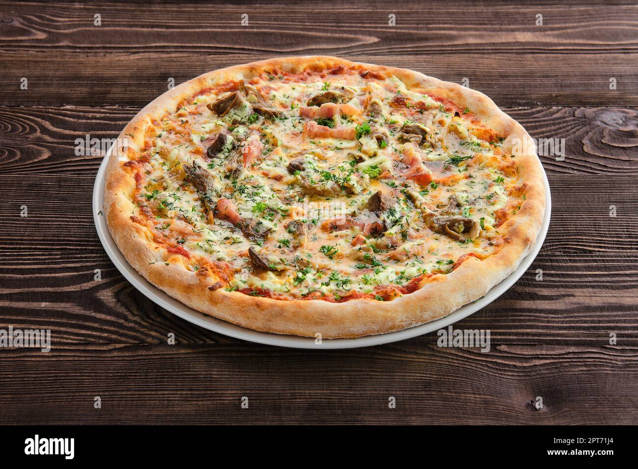 Thick crust pizza with ham, pumpkin and oyster mushrooms Stock Photo ...