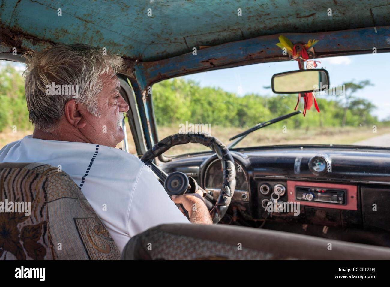 Taxi driver, US classic car, Trinidad, Cuba Stock Photo - Alamy