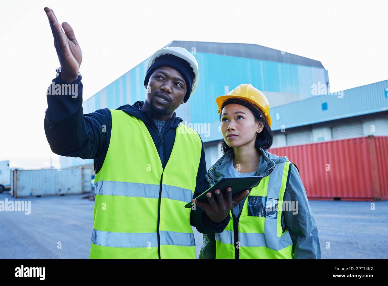 Logistics, black man and Asian woman with tablet, shipping and ...