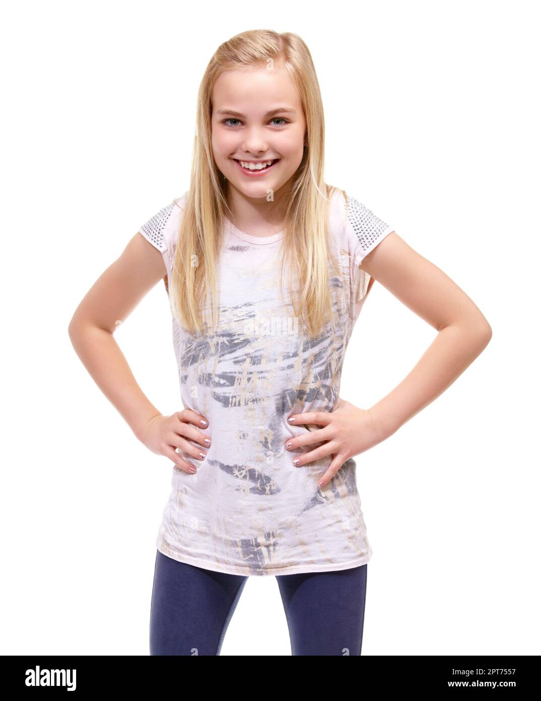 Shes got confidence. Young girl posing confidently against a white ...