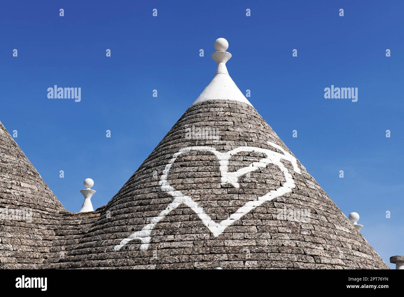 Trulli with symbol on the roof, Heart, Alberobello, Valle d'Itria ...