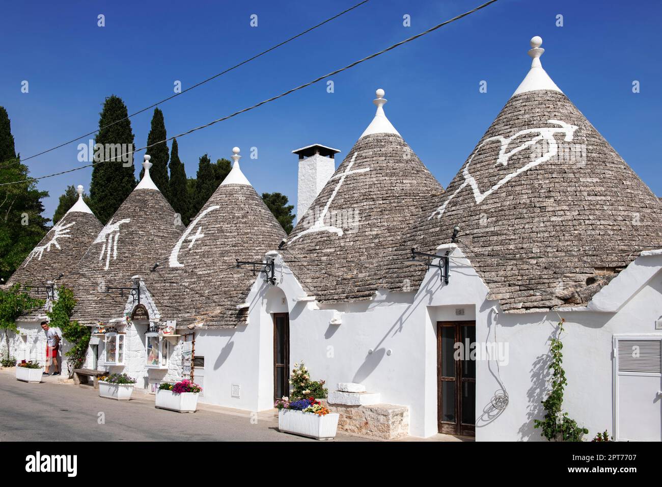 Trulli with symbols on the roof, Alberobello, Valle d'Itria, Apulia ...