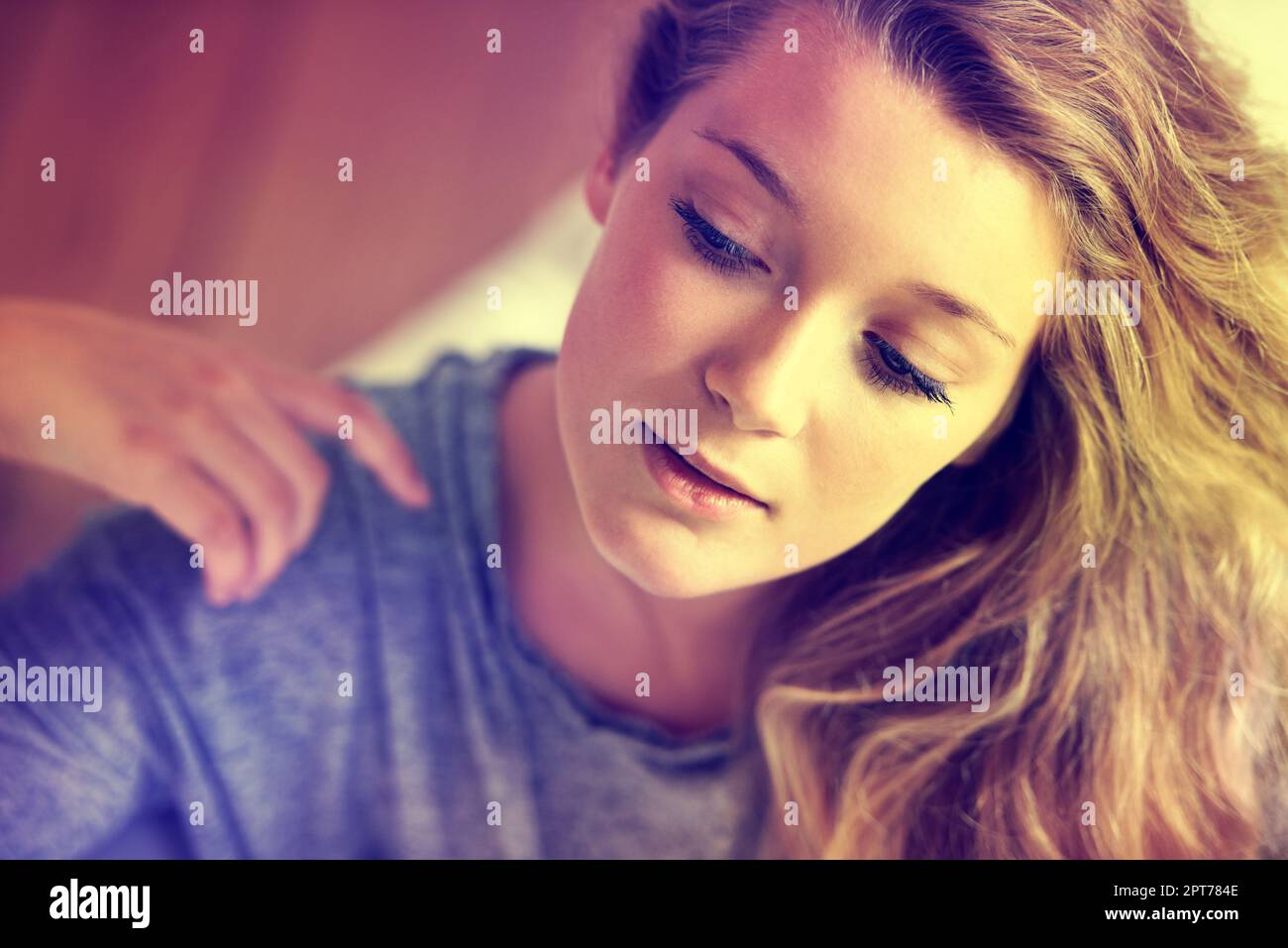 Home alone for the day. A beautiful young girl relaxing indoors at home ...