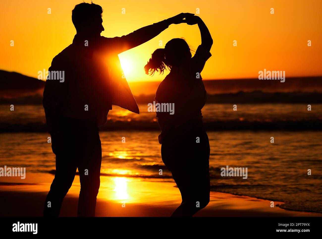 Sunset, dance and silhouette of couple by the beach together for love, travel and Puerto Rico ...