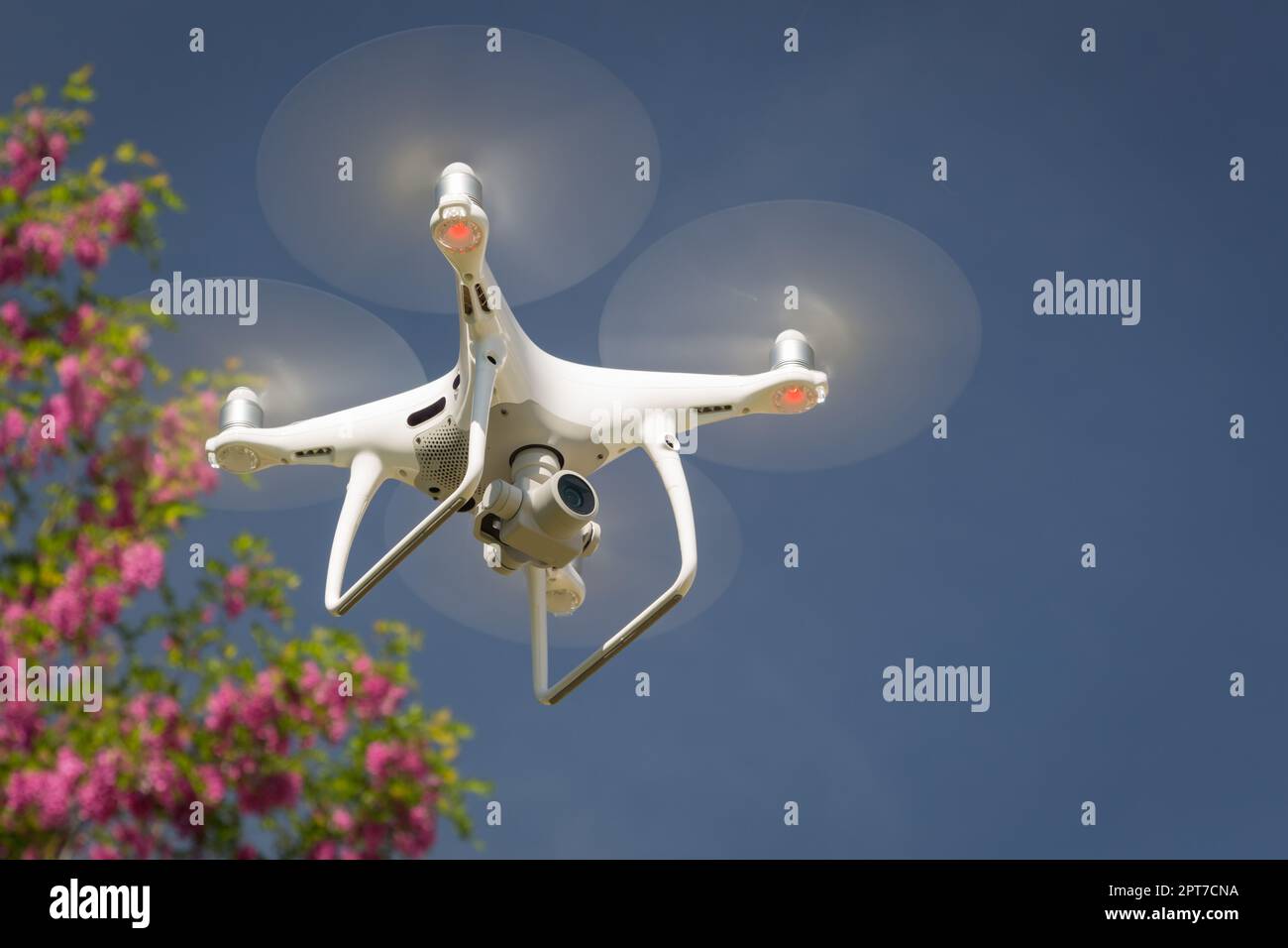 Unmanned Aircraft System (UAV) Quadcopter Drone In The Air Stock Photo ...