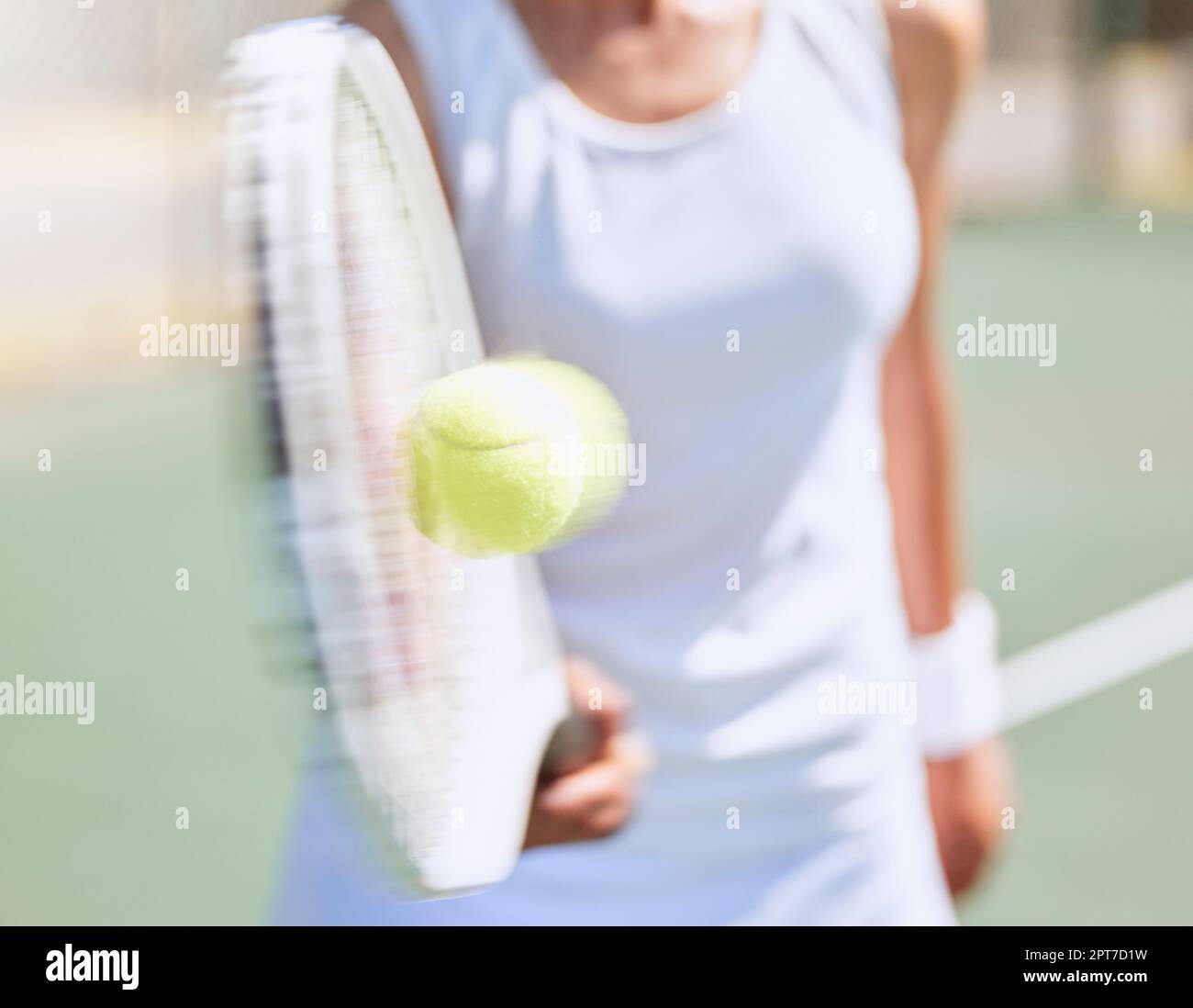 Fitness, tennis and a woman hitting ball with racket or bat on outdoor ...