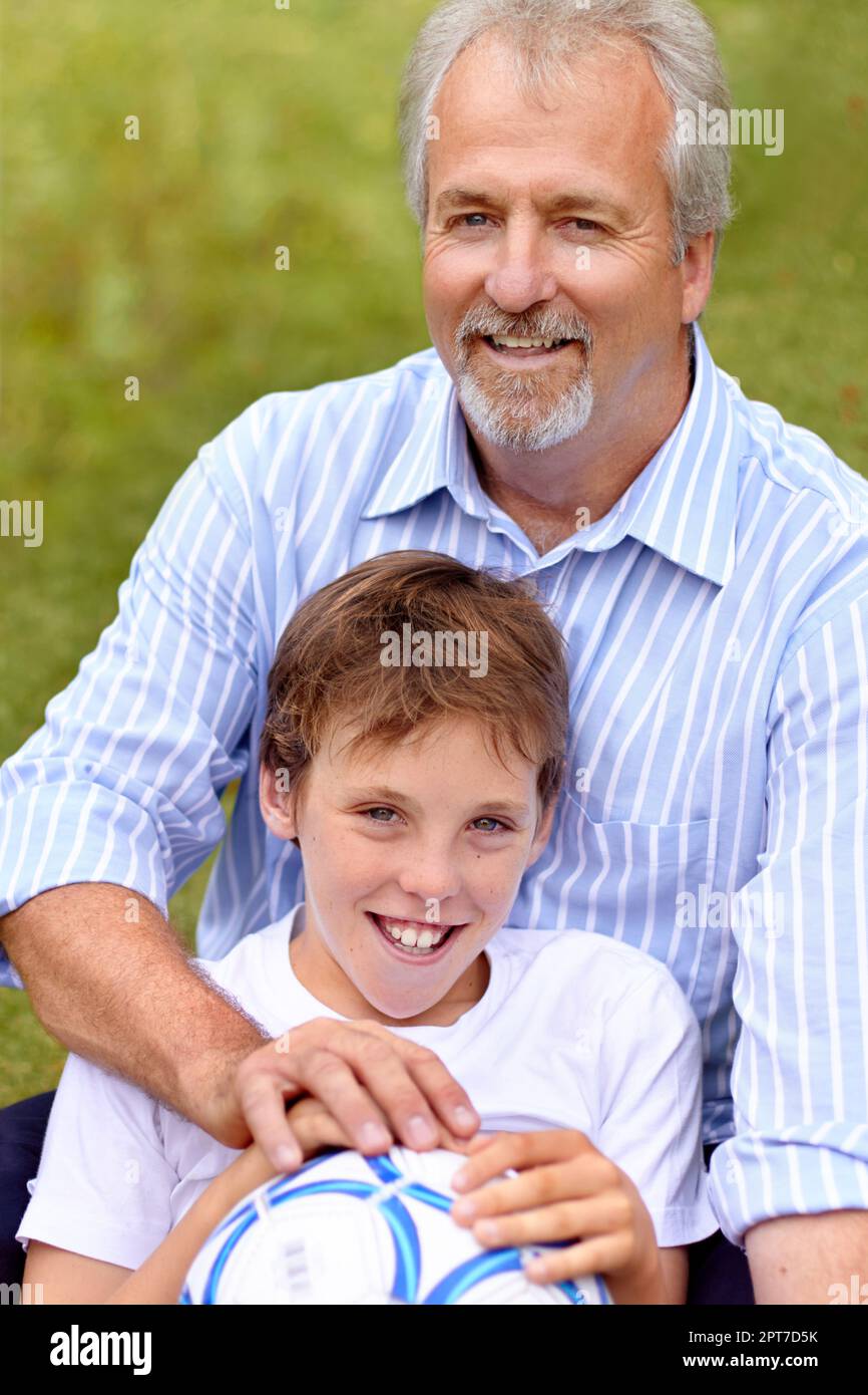 Good fathers make good sons. a father and son spending time at the park ...