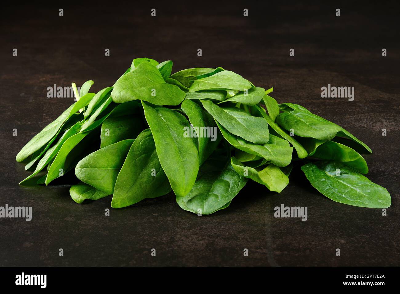 Leavews of fresh spinach on dark background Stock Photo - Alamy