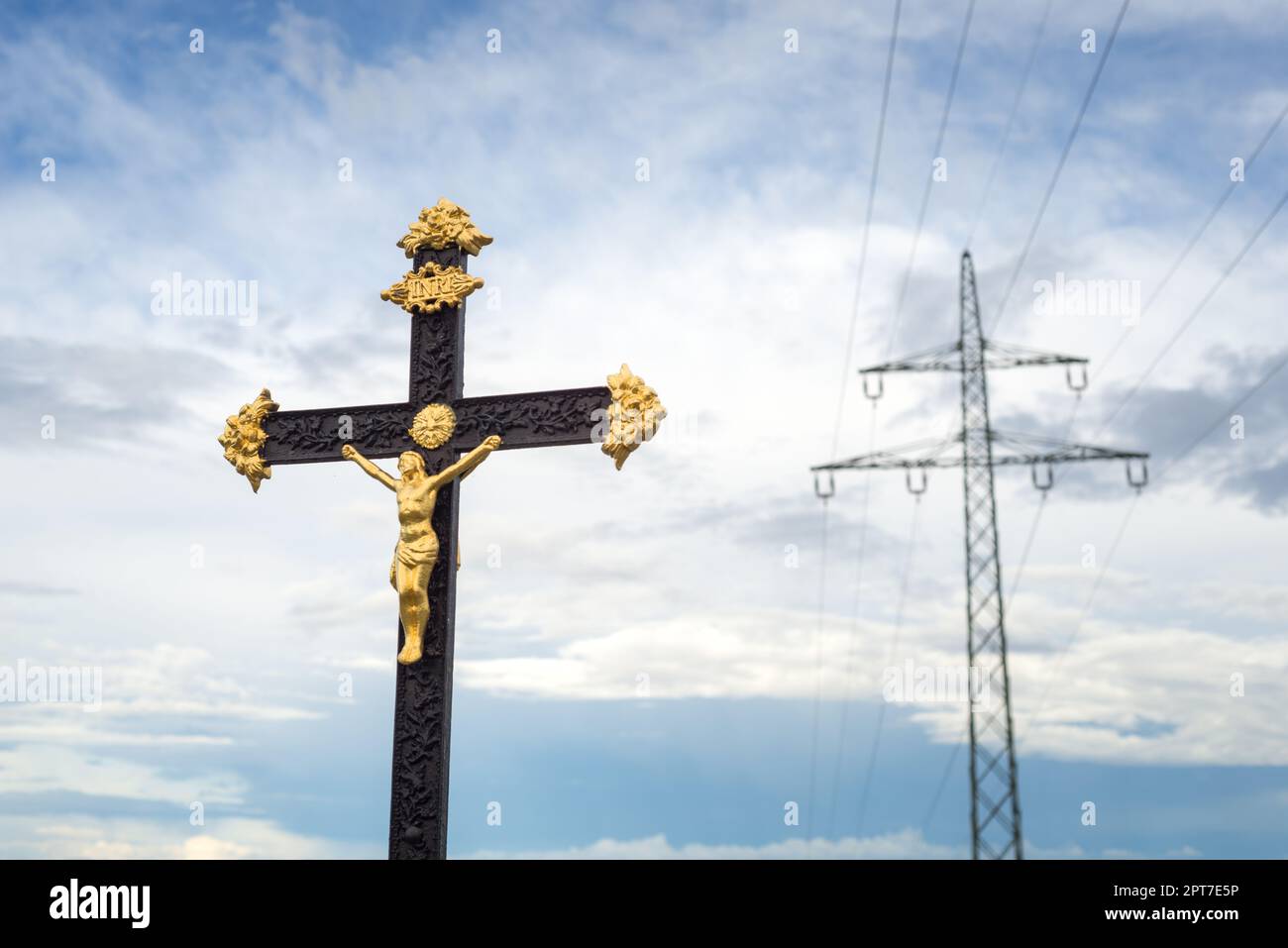 Sculpture Of Jesus Christ with electricity pylon Stock Photo - Alamy