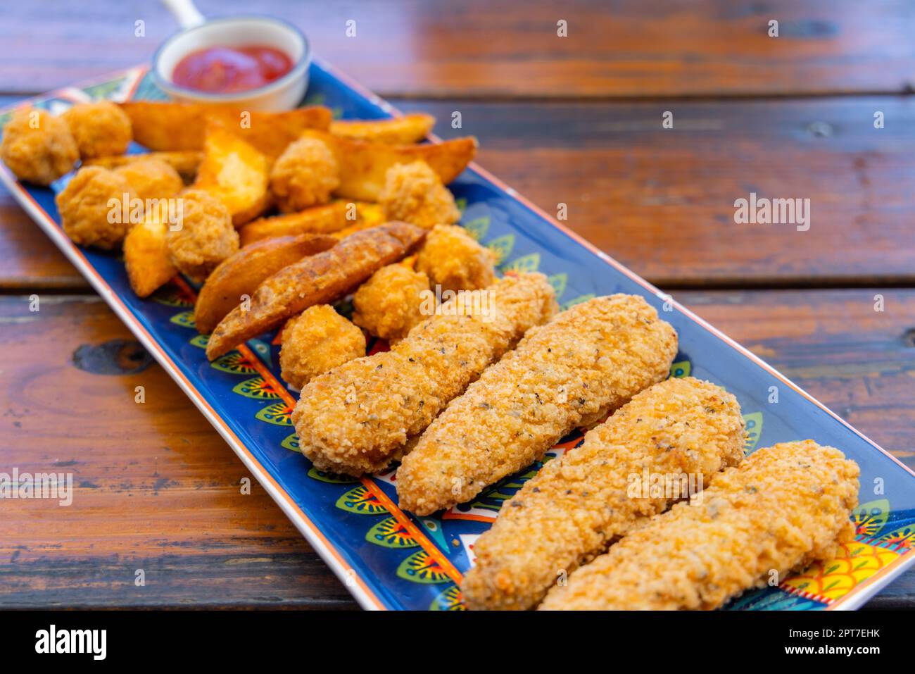Fry fish finger and potato wedges Stock Photo - Alamy