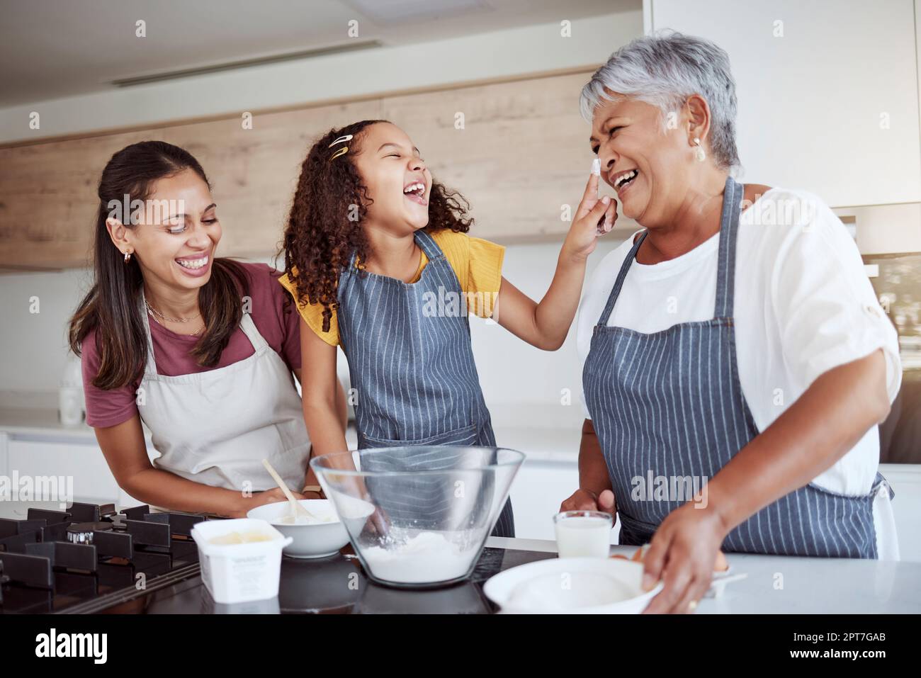 Women, happy family and bake food in kitchen smile together love ...
