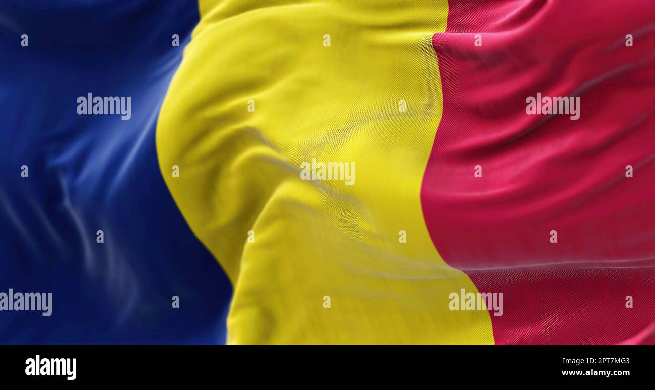 Close-up view of the Chad national flag waving in the wind. The ...