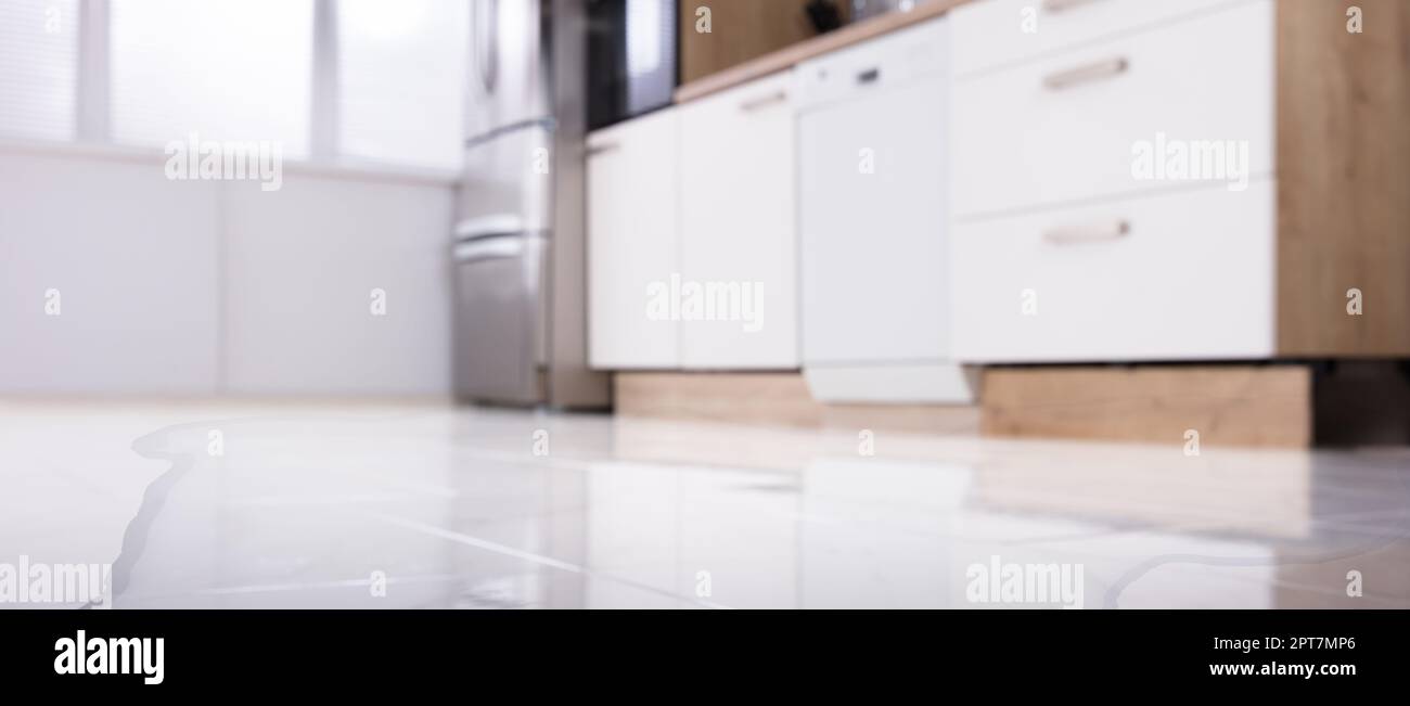 Tile Kitchen Floor Inside Home With Leak And Flood Stock Photo - Alamy