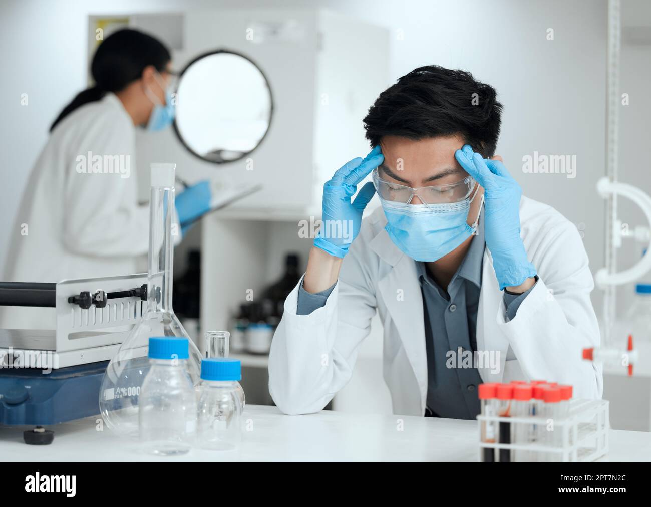 I can feel the walls closing in. a young scientist looking stressed out ...