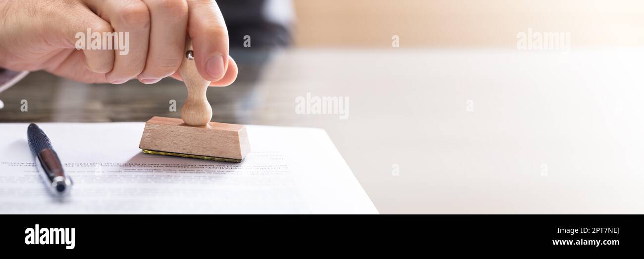 Person Hand Confidential Document Stamp Approval On Desk Stock Photo ...