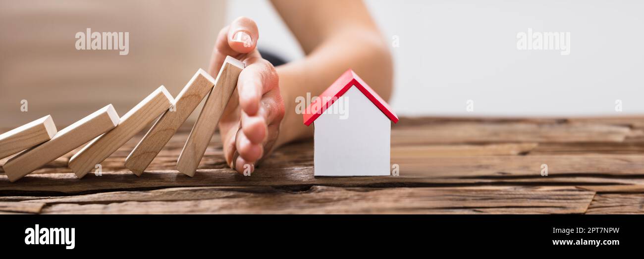 Falling Domino Chain And Home Protection. House Insurance Stock Photo ...