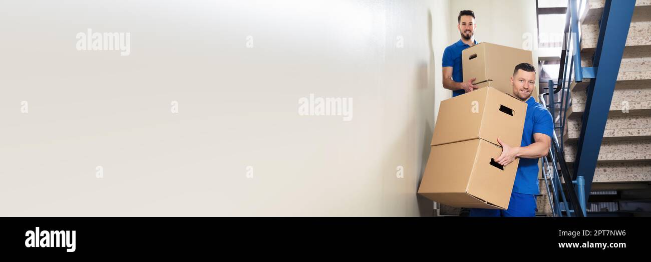 Movers Team Carrying Boxes Down Stairs. Mover Delivery Service Stock ...