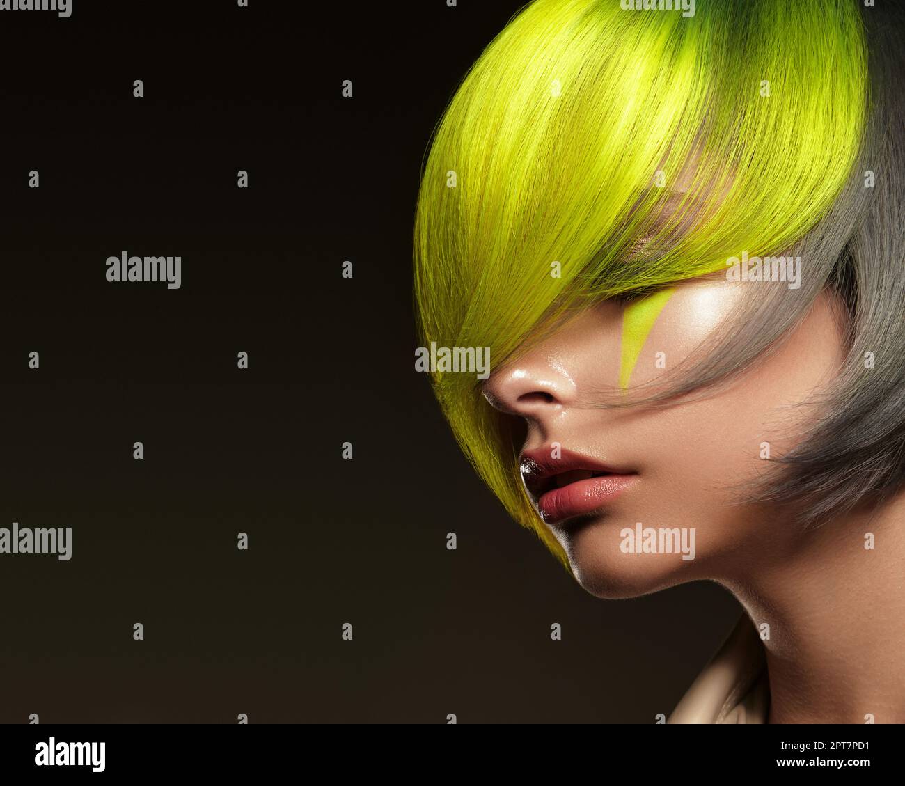 Portrait of beautiful woman with multi-colored hair and creative make ...