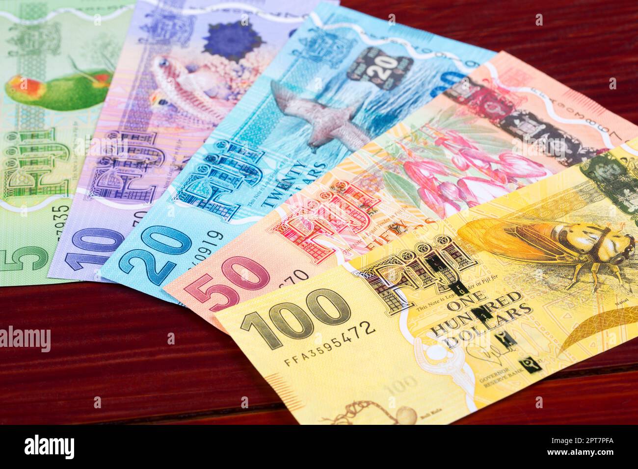 Fijian money - Dollars a business background Stock Photo - Alamy