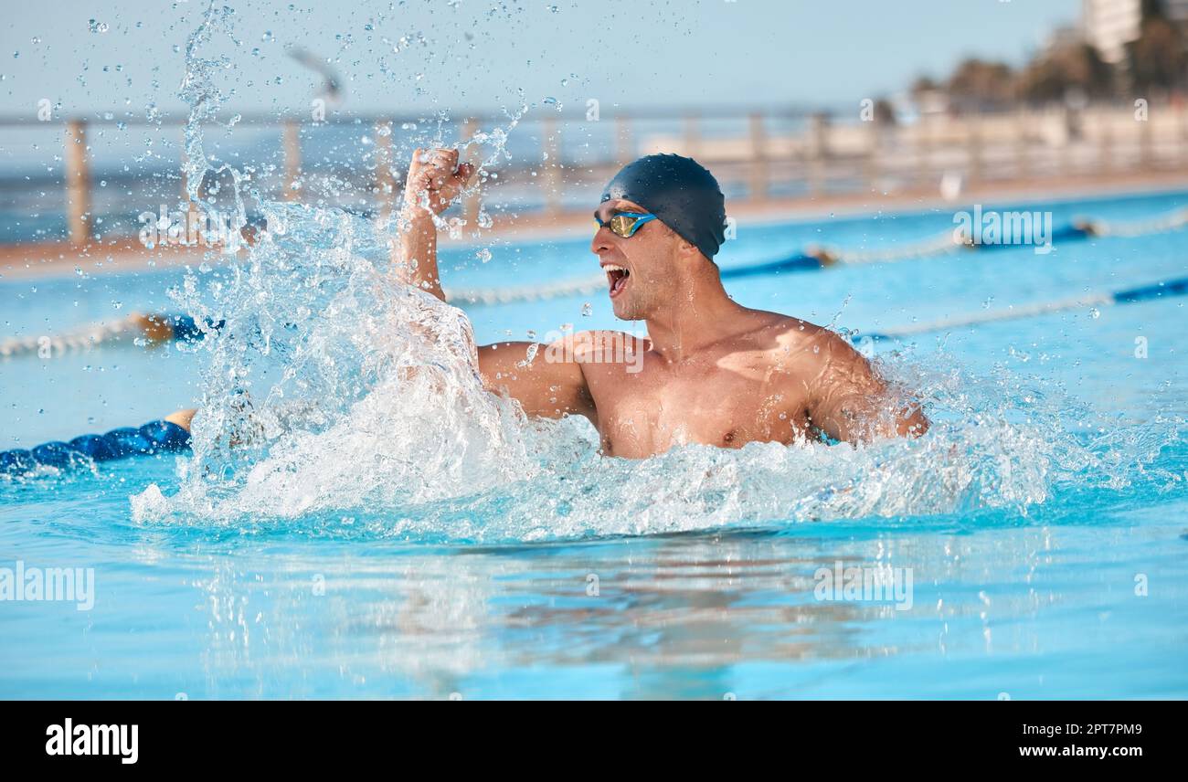 A new record. a handsome young male athlete swimming in an olympic ...