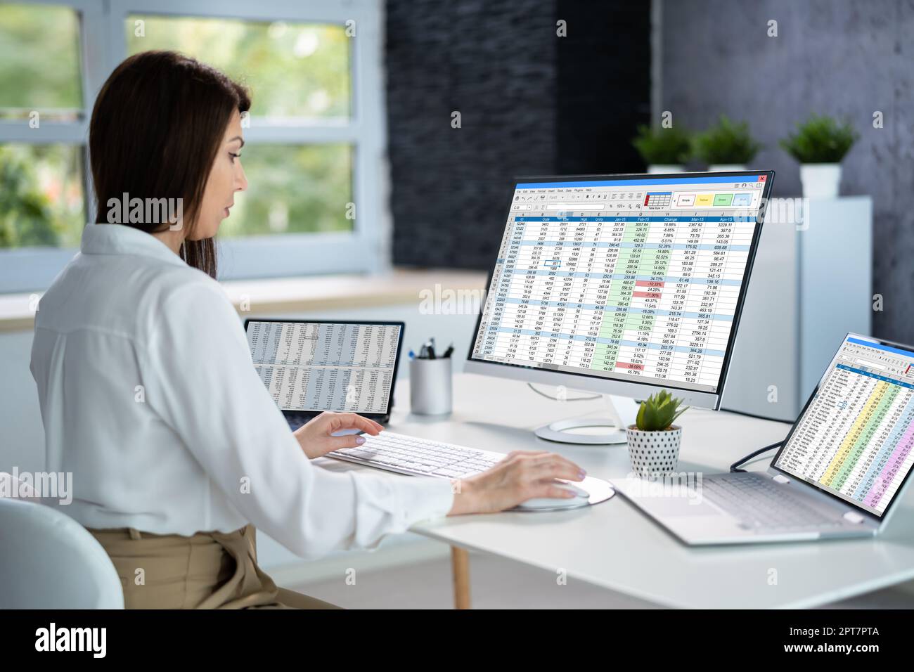 Data Analyst Woman Using Spreadsheet On Computer Stock Photo - Alamy