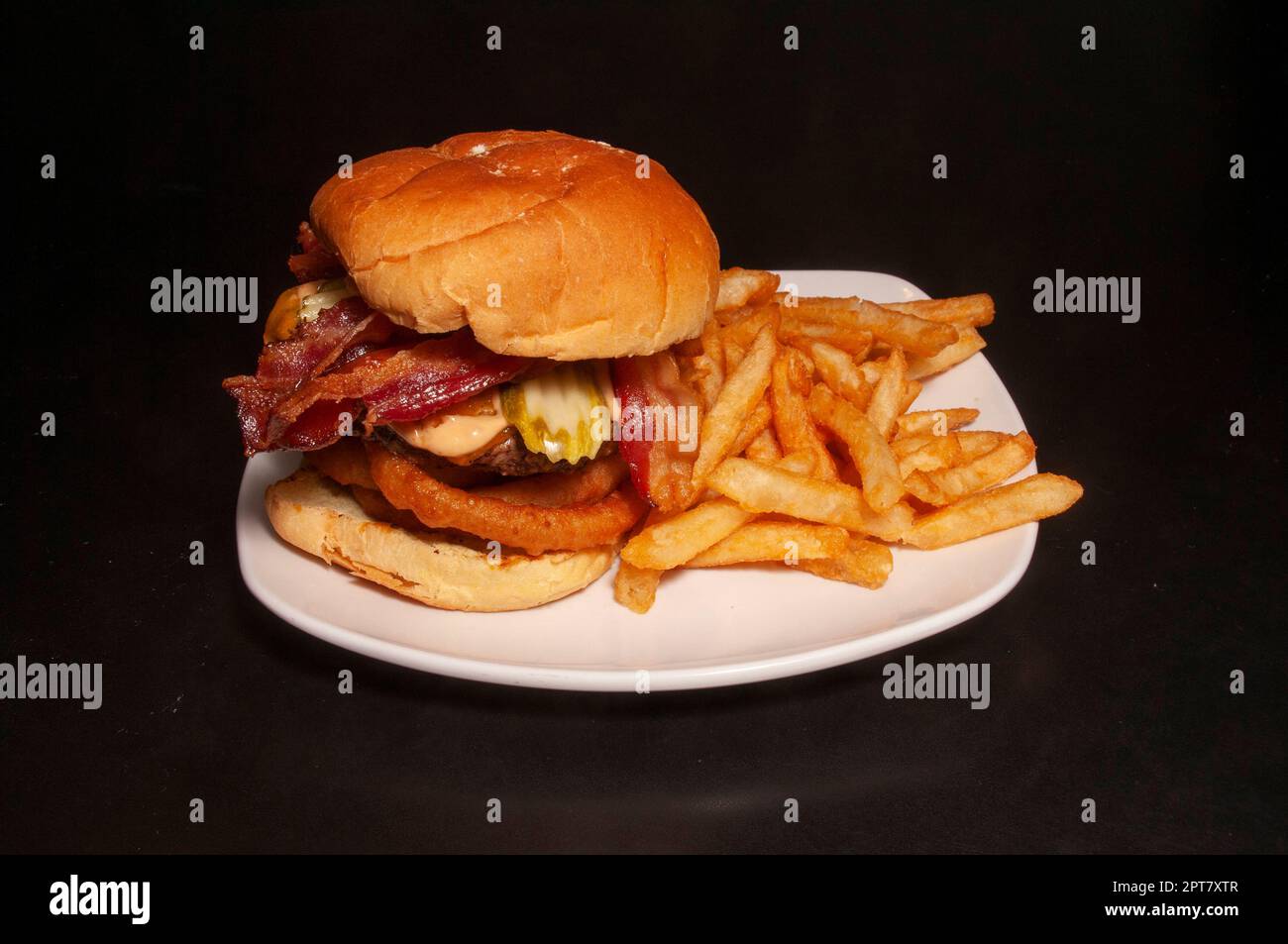 Delicious cheeseburger known as an onion ring cowboy burger Stock Photo ...