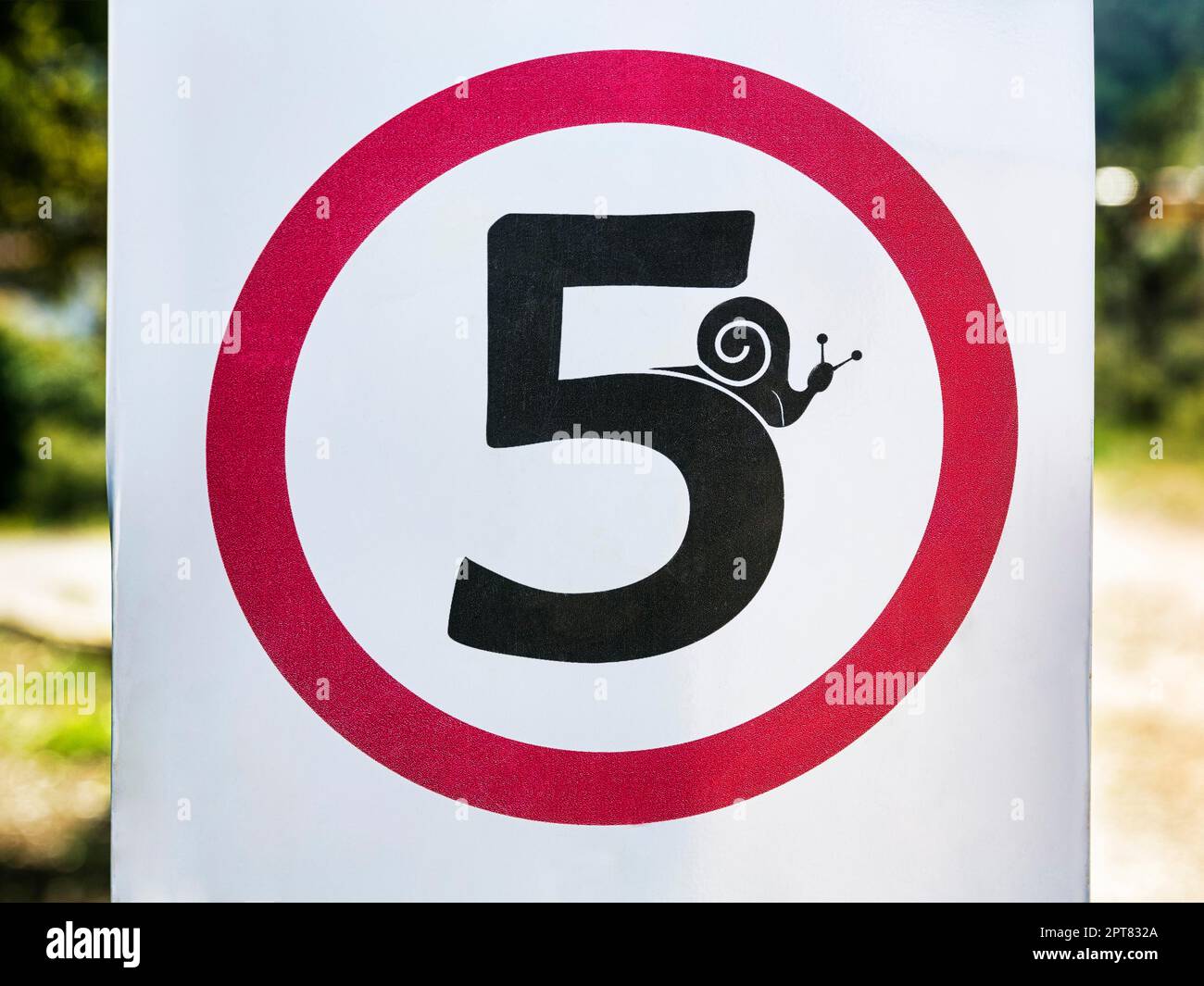 Homemade original traffic sign, number 5 with pictogram snail, drive ...