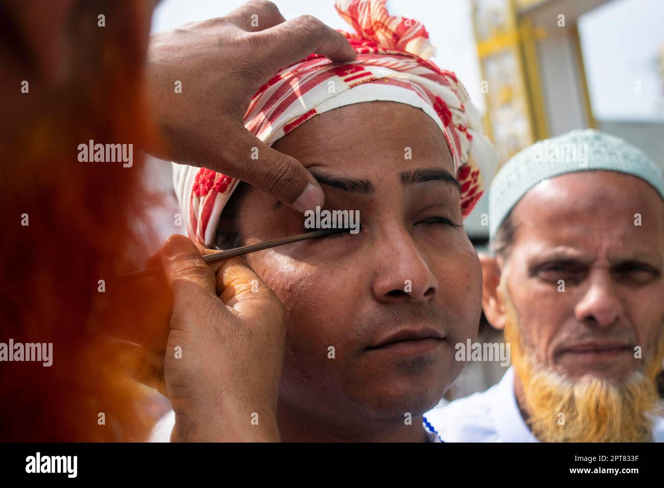 Guwahati, India. 22 April 2023. A Muslim man applies Surma on eyes ...