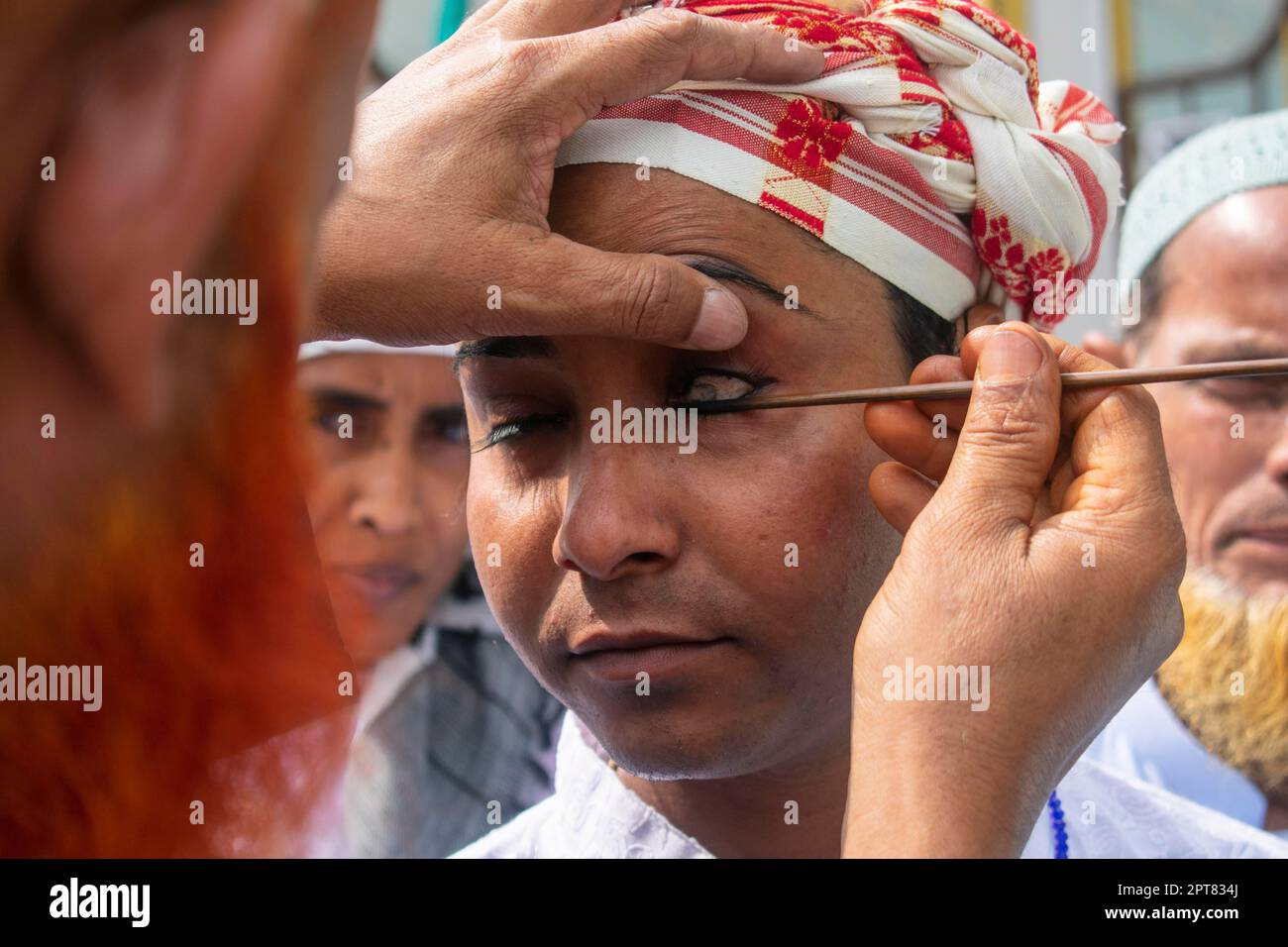 Guwahati, India. 22 April 2023. A Muslim man applies Surma on eyes ...