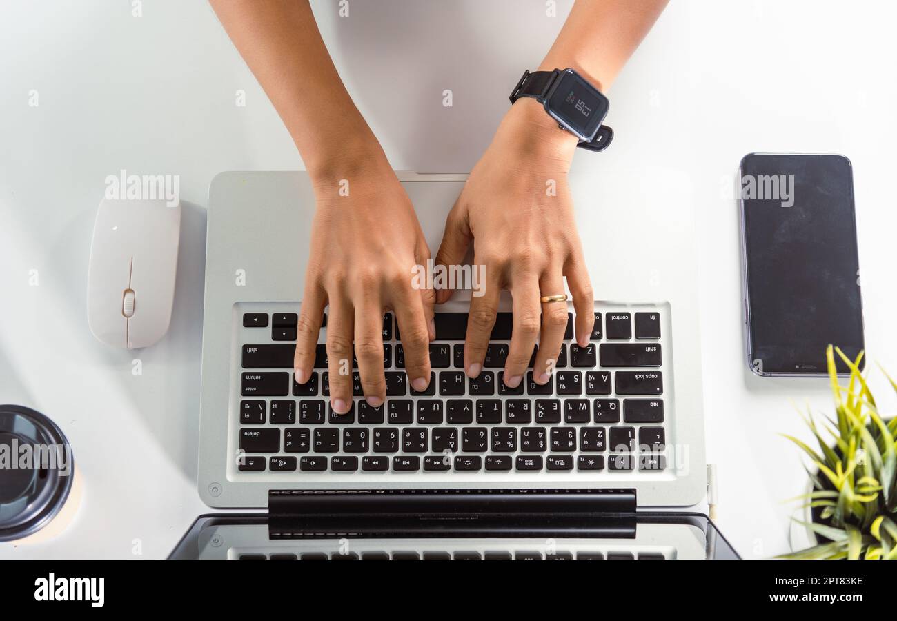Typing keyboard. Close up Hands of business woman over laptop keypad ...