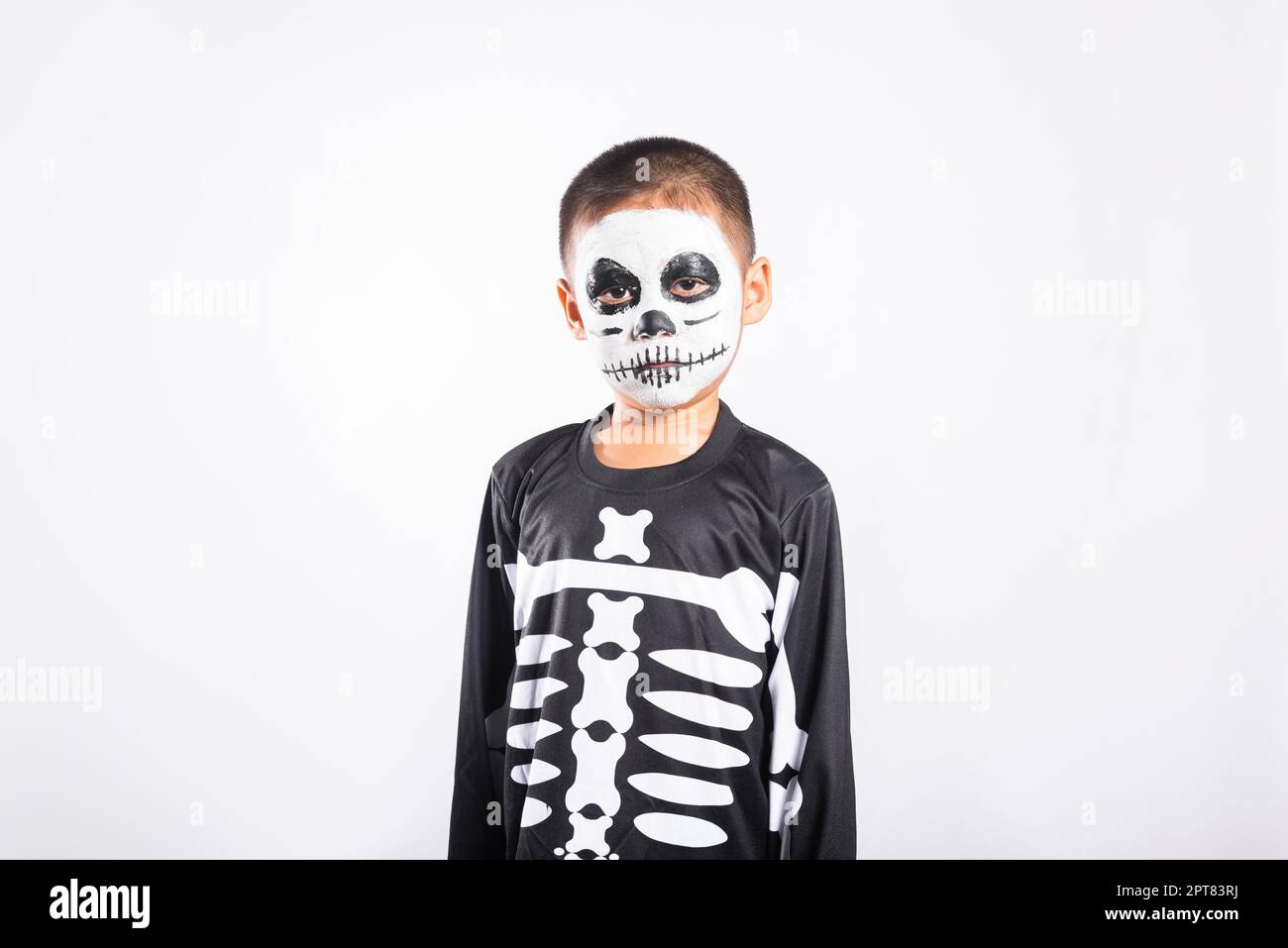 Halloween Kid. Portrait of Asian little kid boy wearing skeleton ...