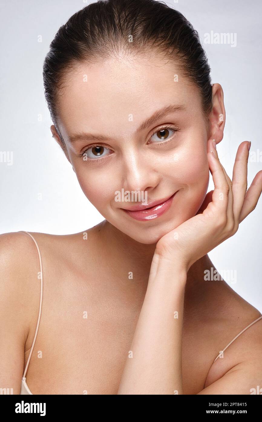Portrait of beautiful woman with light natural make-up and perfect skin ...
