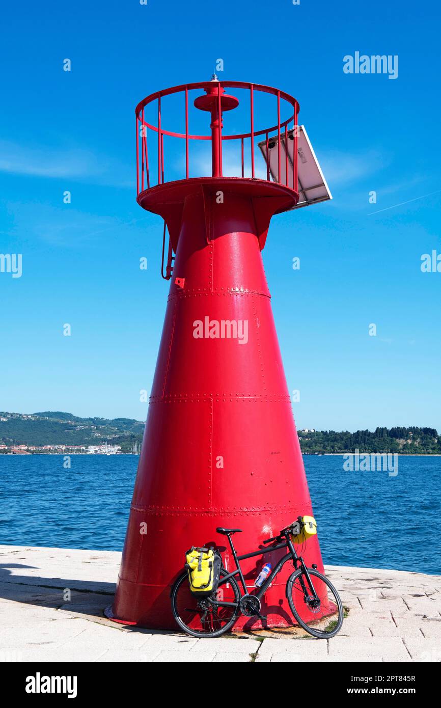 Bike in front of the lighthouse, Parenzana cycle path, Portoroz ...