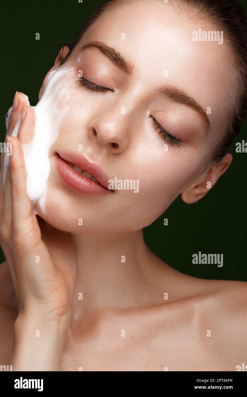 Beautiful young girl with facial wash on the skin. Beauty face. Picture ...