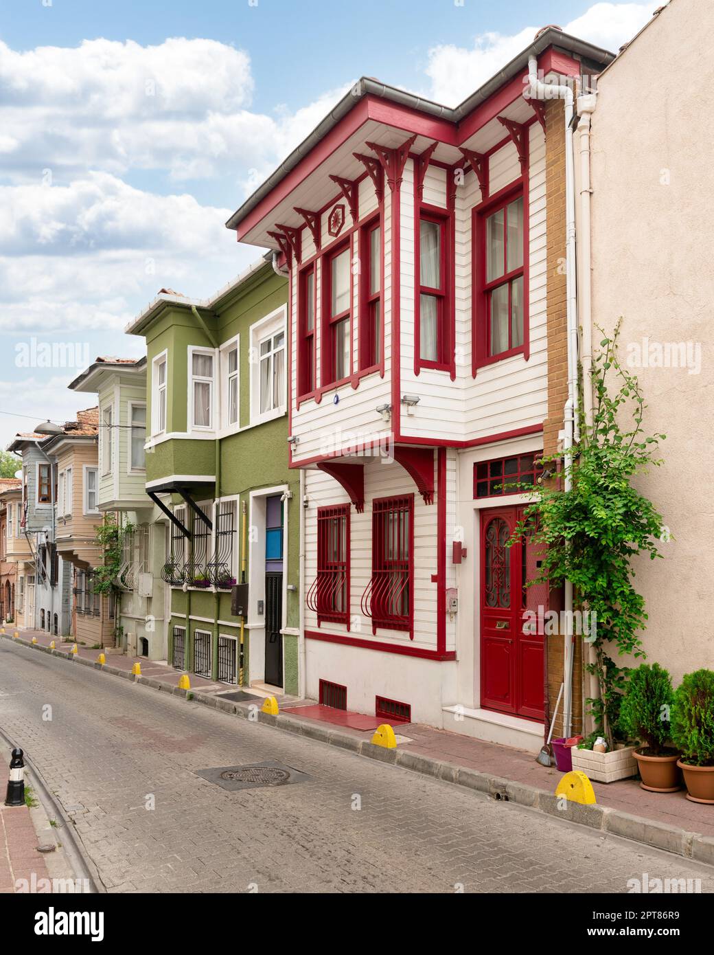 Cobblestone alley, with beautiful old colorful traditional wooden ...