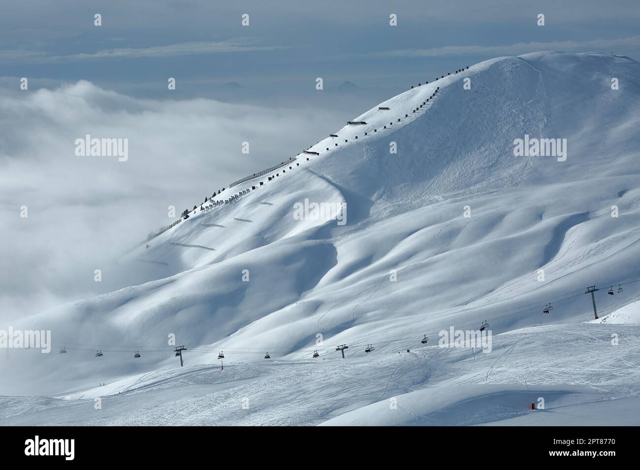 Skiing slope in the French Alpes, fog Stock Photo - Alamy