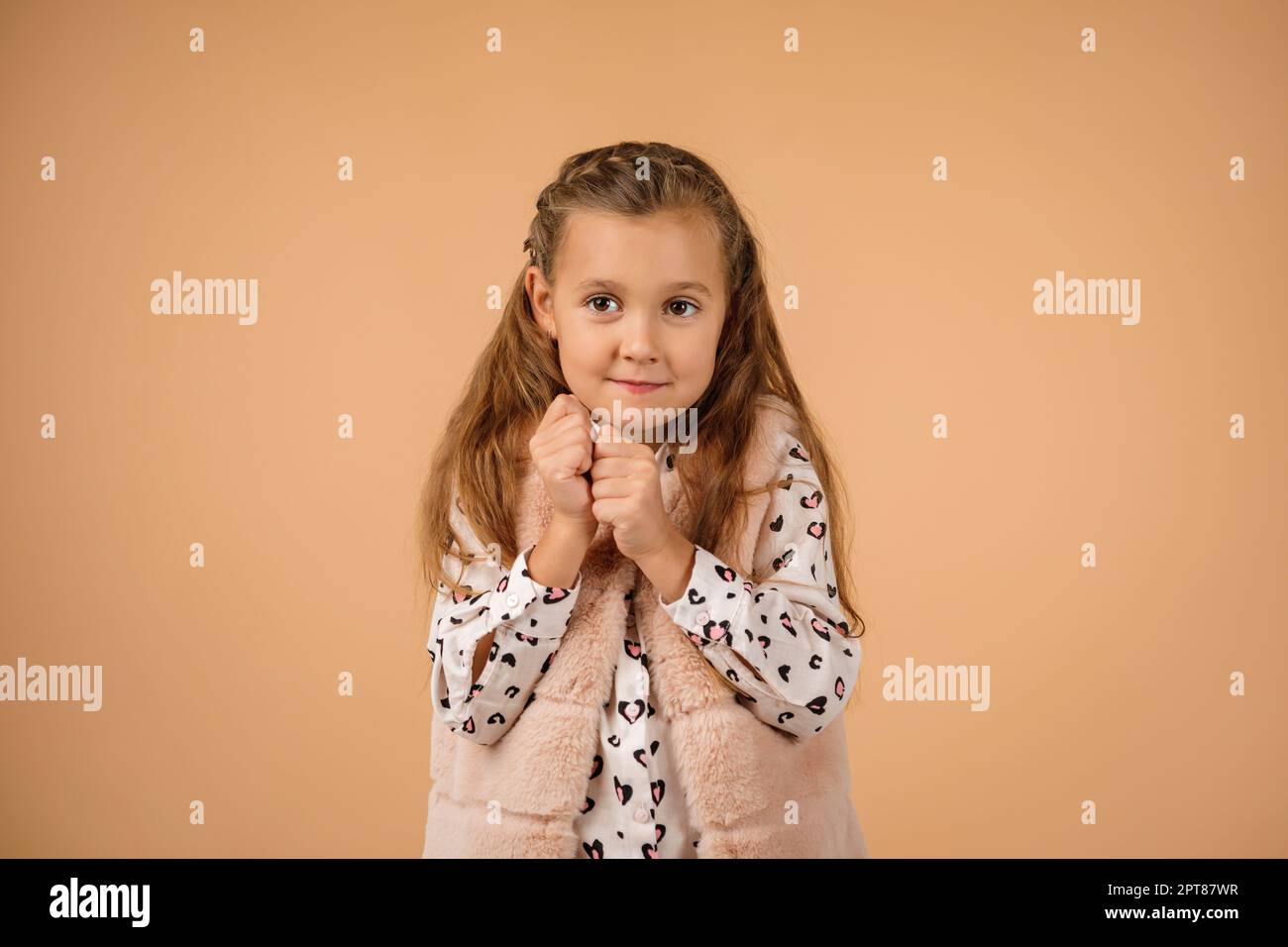 Cute shy little child girl on beige background. Human emotions Stock ...