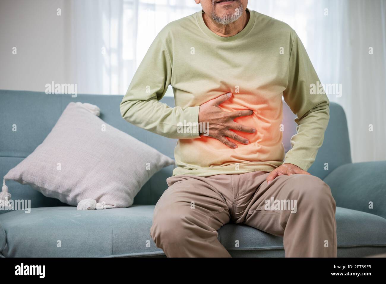 Asian man feeling stomach pain hi-res stock photography and images - Alamy