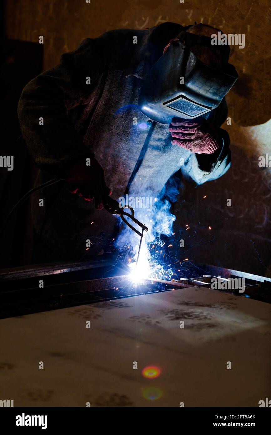 Man welding in uniform hi-res stock photography and images - Alamy