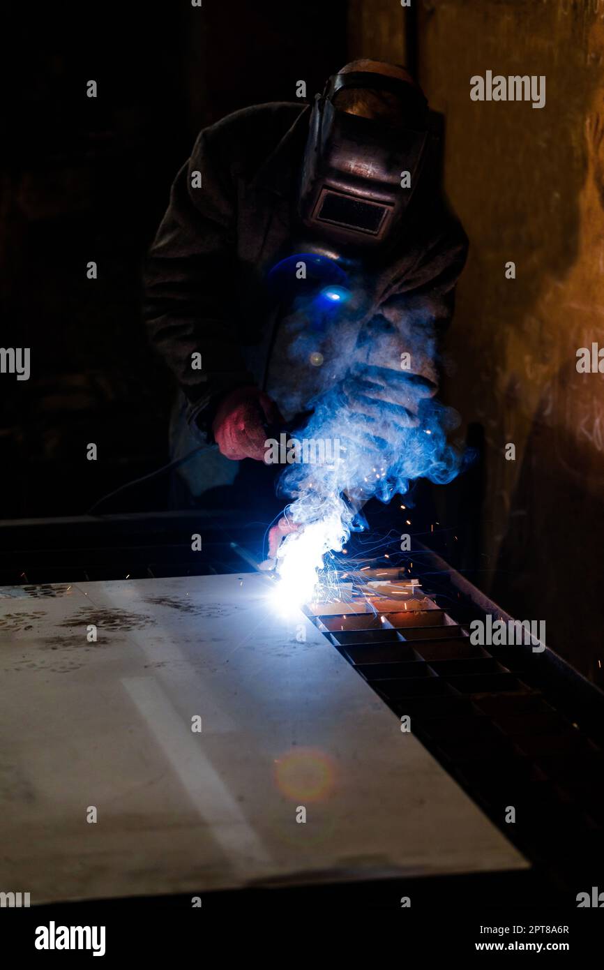 Man welding in uniform hi-res stock photography and images - Alamy